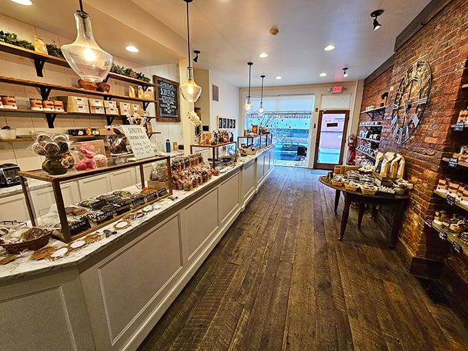 Step inside and witness confectionery perfection—rustic wooden floors, exposed brick, and display cases that make adults feel like wide-eyed kids again.