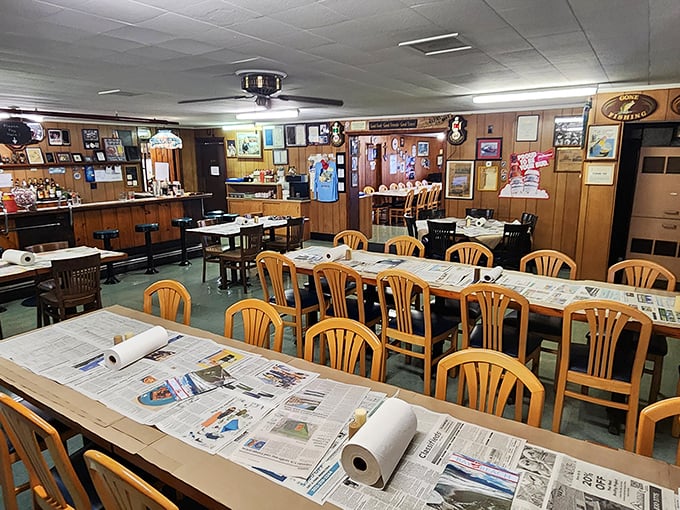 Newspaper-covered tables and wooden chairs create the perfect setting for serious seafood conversations and messy crab adventures.