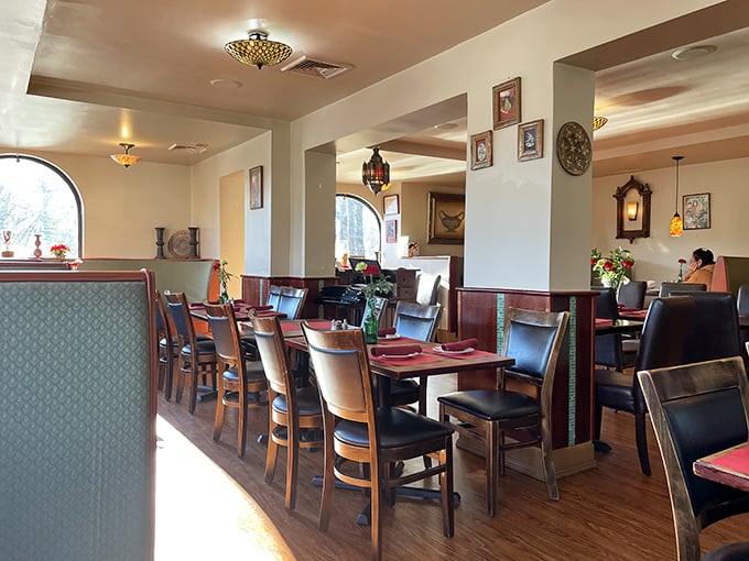 Warm lighting and elegant arches create an atmosphere where every meal feels like a special occasion worth savoring.