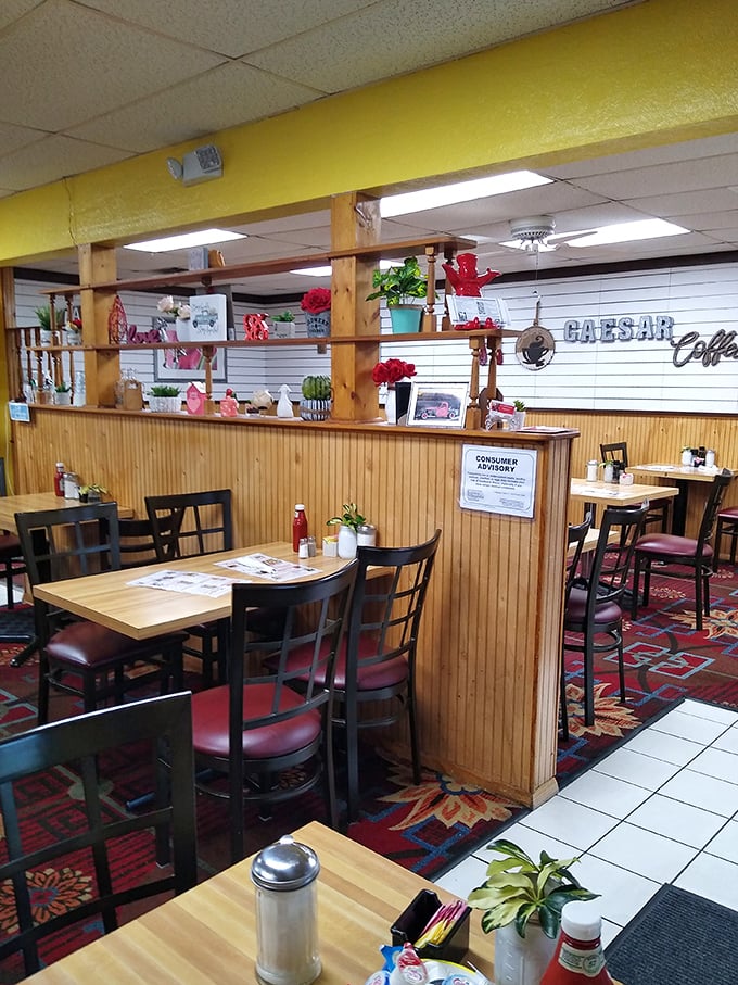 Wooden paneling, red carpeting, and simple tables create that perfect diner atmosphere where comfort trumps pretension and breakfast reigns supreme.