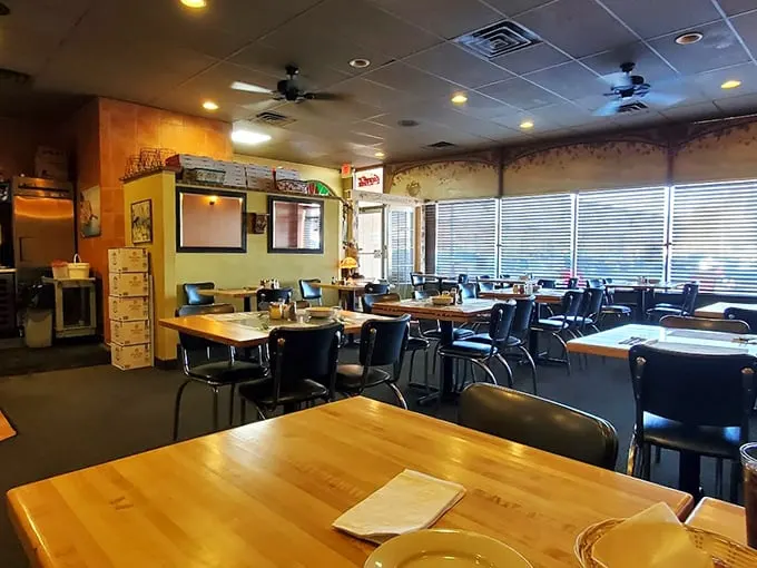 Inside, wooden tables and simple chairs create that classic Italian-American eatery vibe where the focus is squarely where it belongs—on the food.