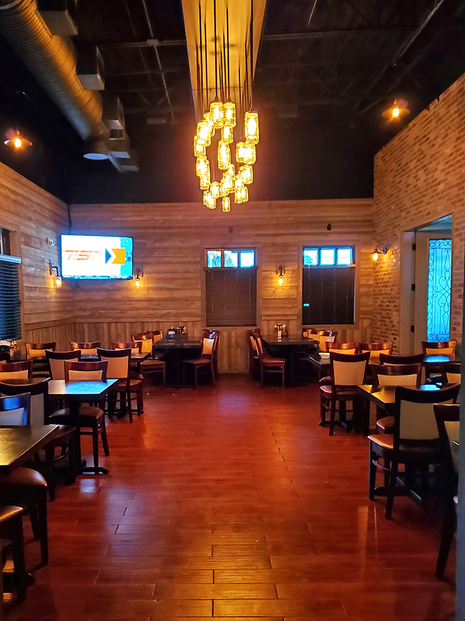 This isn't your grandfather's steakhouse – unless your grandfather had impeccable taste in Edison bulbs and exposed brick.