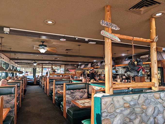 Step inside and you're transported to a rustic mountain lodge where wooden beams and bear-themed decor create the perfect backdrop for serious comfort food consumption.