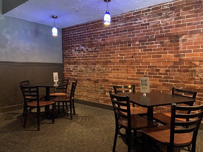 Exposed brick walls tell stories while pendant lights cast a warm glow. This isn't just dining—it's time travel to when conversations mattered more than cell service.
