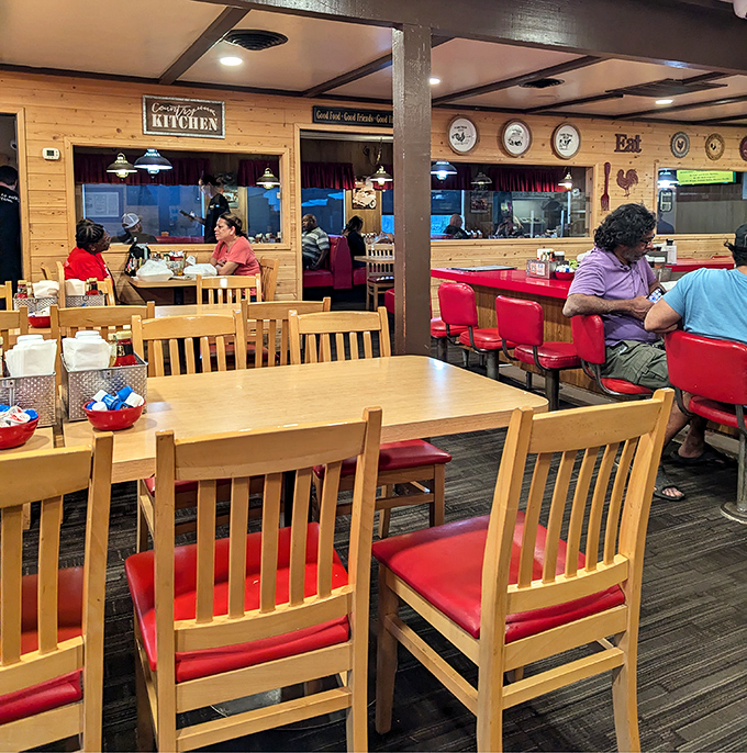 Classic diner comfort meets cabin-cozy vibes inside, where those red vinyl seats aren't just for sitting – they're thrones for pancake royalty.