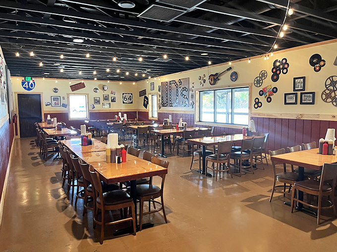 Where barbecue dreams come true. Simple wooden tables, eclectic wall decor, and the promise of smoky delights to come.