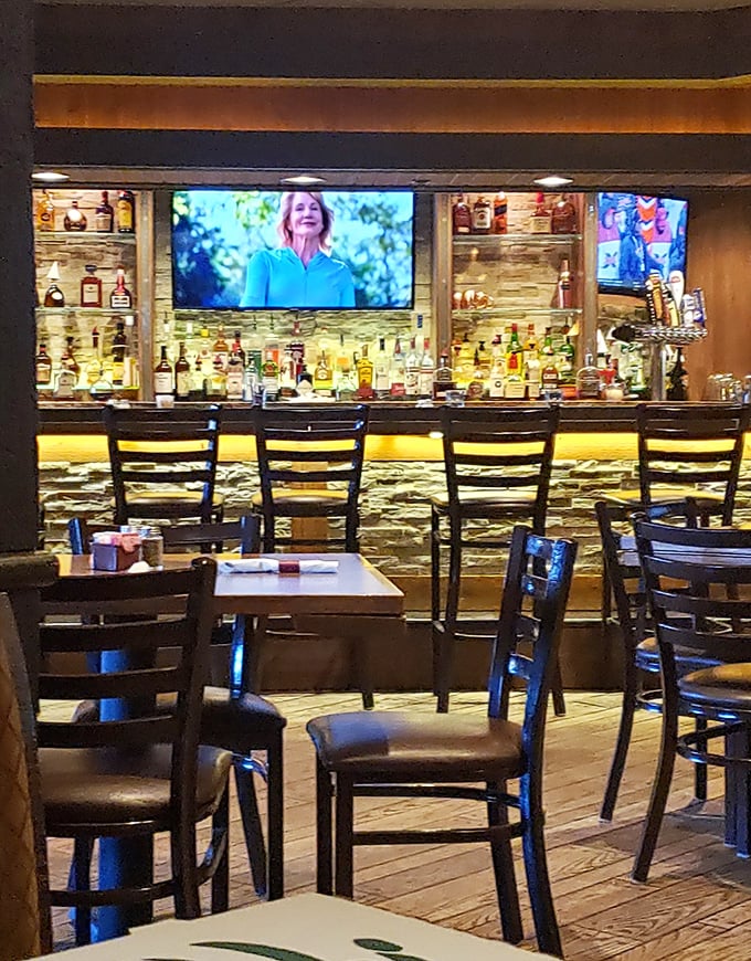 The bar area strikes that perfect balance—warm lighting, well-stocked shelves, and enough TVs to catch the Lions game without feeling like a sports bar.