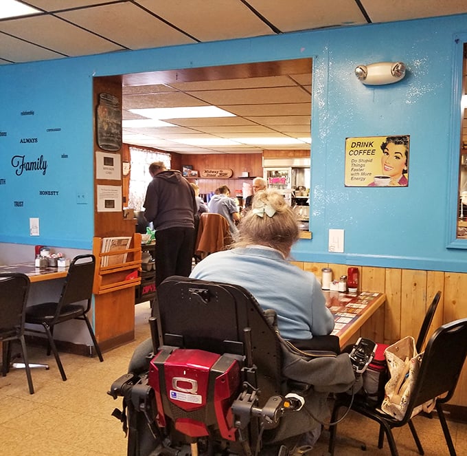 Blue walls adorned with words like "Family" create the perfect backdrop for morning conversations and coffee refills that never seem to end.