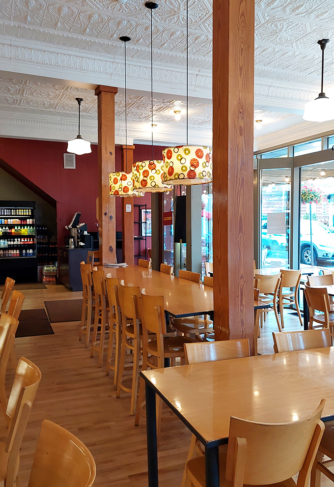 Warm wooden accents and ornate tin ceilings create an atmosphere that's both elegant and comfortably worn-in—the perfect setting for carb-induced euphoria.