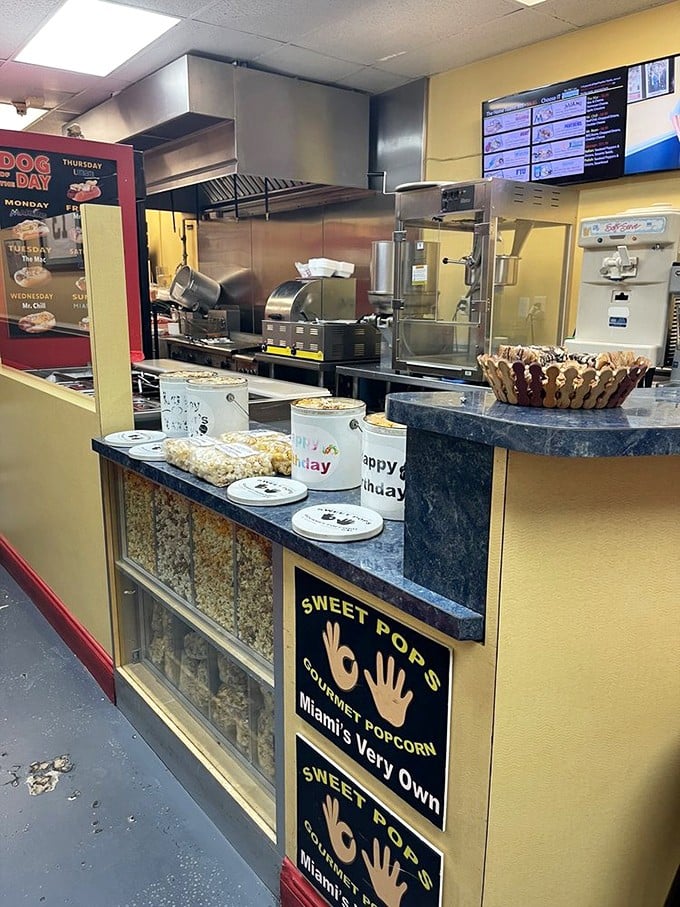 Behind the counter, culinary magic happens in plain sight. No smoke and mirrors here—just the honest craft of hot dog perfection.