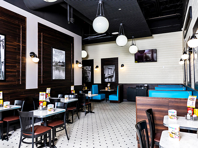 Inside, nostalgia meets modern comfort with classic deli aesthetics—black and white photos, pendant lighting, and booths that invite you to settle in for the long haul.