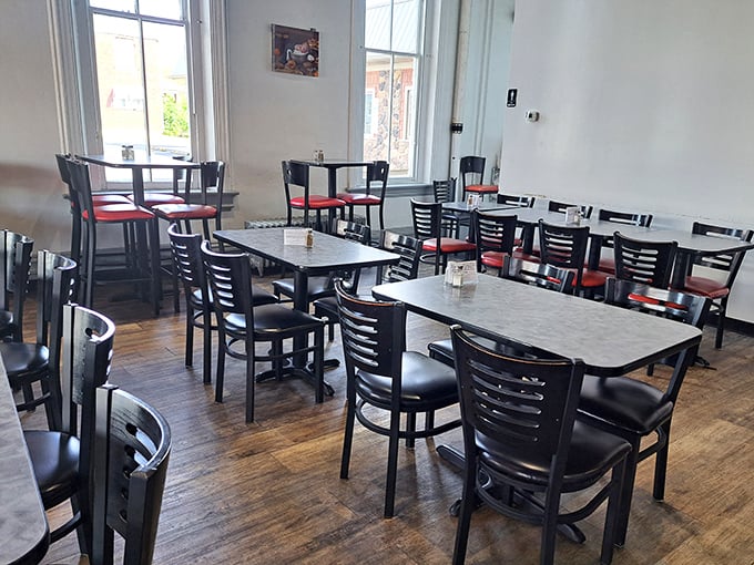Simple, unpretentious dining space where conversations flow as freely as the coffee. No designer lighting fixtures here—just honest food and the warm buzz of community.