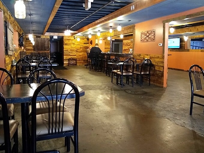 Rustic wooden walls and simple furnishings let you know immediately – this place prioritizes substance over style. The food does all the talking here.