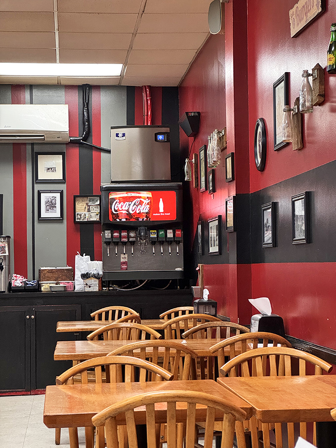 Red and black walls lined with memorabilia create the perfect backdrop for comfort food conversations. No Instagram filters needed here.