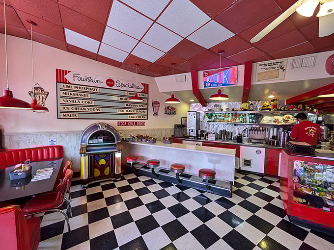 Step inside and the 1950s never ended—gleaming countertops, cherry-red booths, and a jukebox that's seen more quarters than a laundromat during college move-in week.