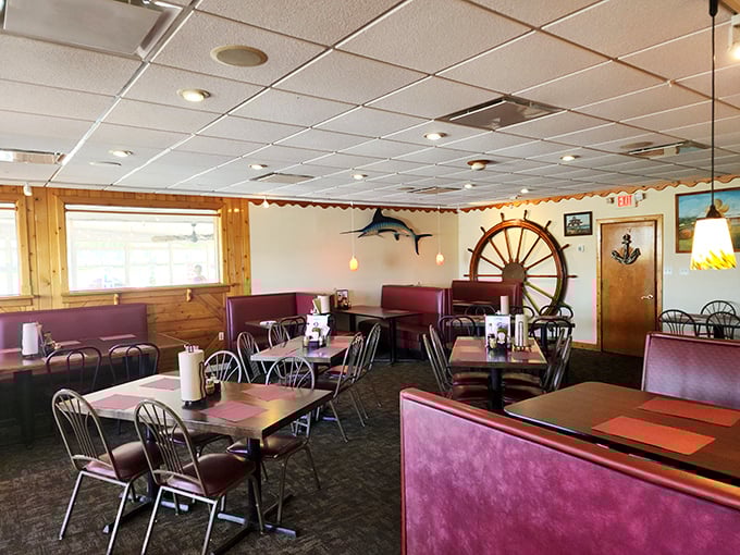 Nautical charm meets cozy comfort in Meding's dining room, where that ship's wheel isn't just decoration – it's steering you toward seafood nirvana.