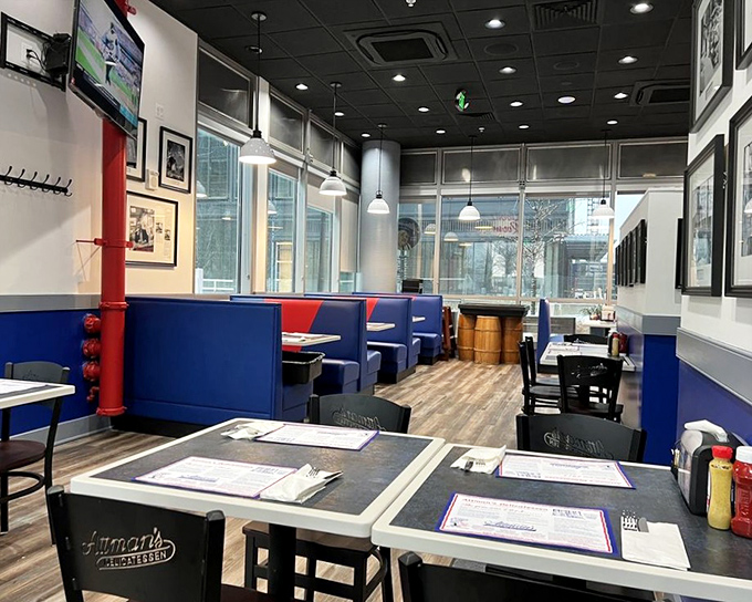 Inside the Kibbitz Room, blue booths and simple tables create the perfect backdrop for sandwich artistry. No pretension, just delicious anticipation.