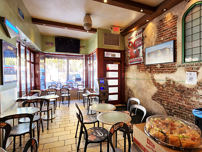 Exposed brick walls and simple tables create the perfect stage for the main event—no distractions, just you and your imminent cheesesteak bliss.