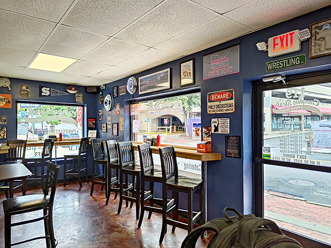 Those navy walls have witnessed more satisfied sighs than a spa, but with better stories.