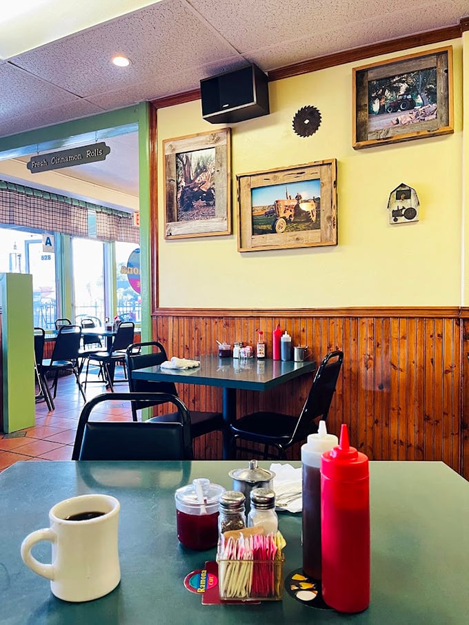 Rustic wooden wainscoting and local photography create that perfect small-town vibe where calories don't count and coffee refills flow freely.