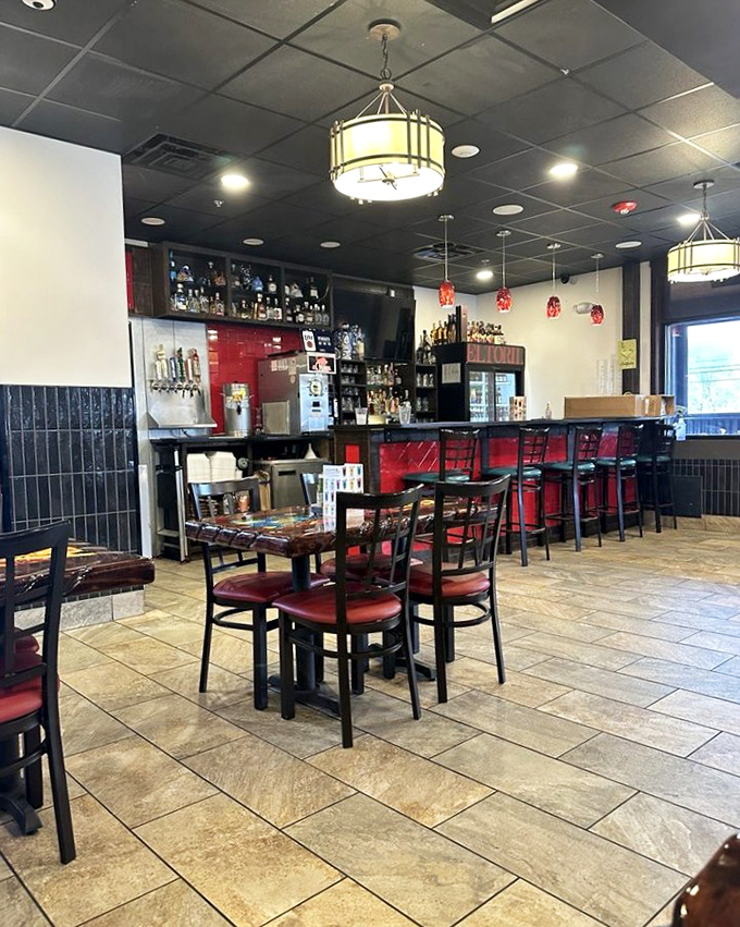 Inside, the clean lines and warm lighting create an atmosphere where the food—not the decor—takes center stage. Those pendant lights aren't just illuminating tables; they're spotlighting culinary magic.