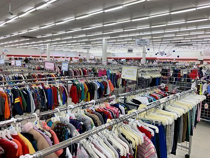 A sea of clothing racks stretches to the horizon. This isn't just shopping—it's an expedition with color-coded trails.