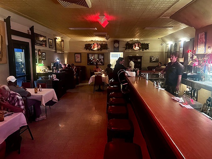 Step inside and time stands still – the warm glow, pressed tin ceiling, and no-nonsense bar create the kind of authentic atmosphere money can't manufacture.