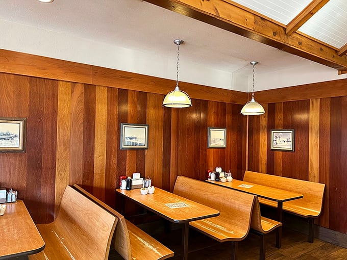 Wood-paneled walls and classic diner booths—this isn't Instagram bait, it's a time machine to when conversations happened without hashtags.