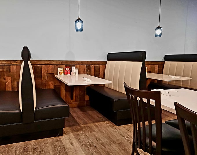 Cozy booths with cream-colored upholstery invite you to settle in for a meal that feels like a warm hug from your favorite aunt.