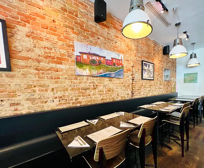 Exposed brick and golden light create the perfect backdrop for your impending chicken enlightenment experience.
