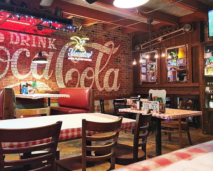 The classic Coca-Cola mural and red checkered tablecloths aren't trying to be retro-cool—they're simply authentic touches from a place that knows what works.