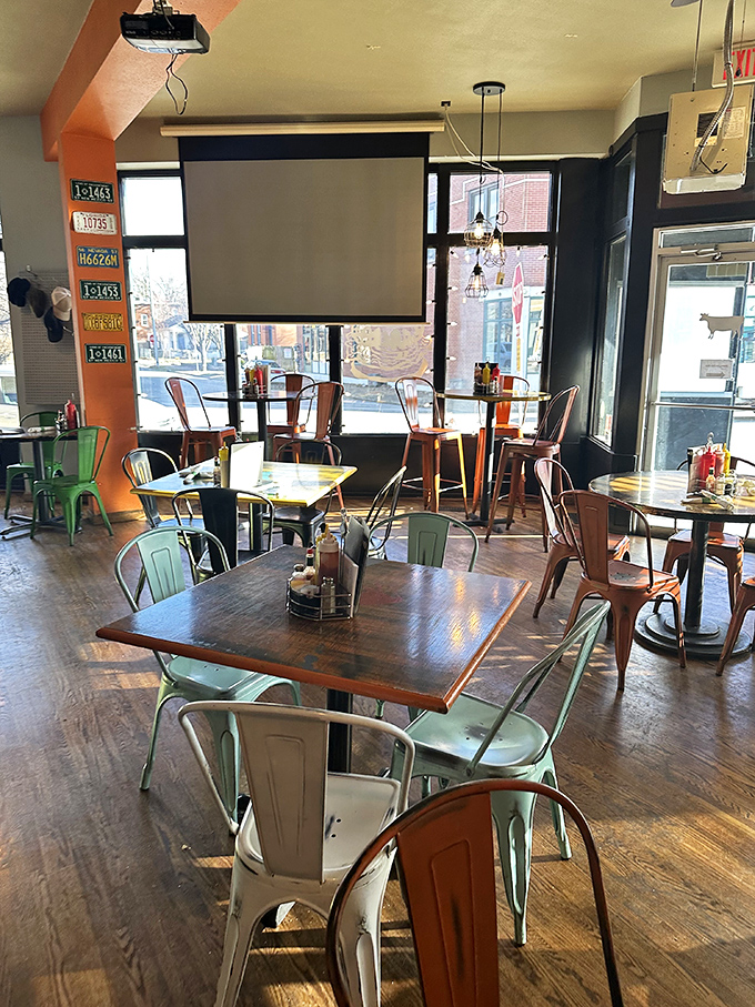 Industrial-chic meets comfort in this dining space where mint-green chairs invite you to settle in for a feast worth remembering.