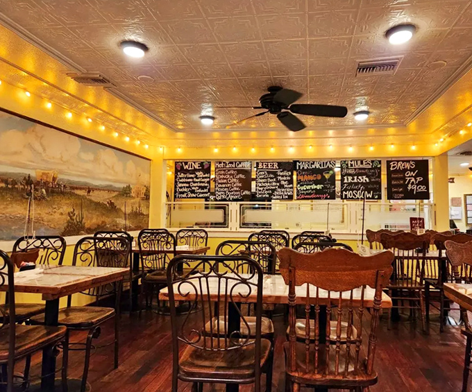 Warm yellow walls, pressed tin ceiling, and wooden chairs create that "I've just discovered something special" feeling that California's barbecue lovers chase.