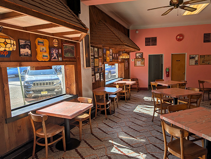 Pink walls, wooden booths, and decades of memories – Zandy's interior feels like stepping into your favorite aunt's kitchen, if she happened to make legendary cheesesteaks.