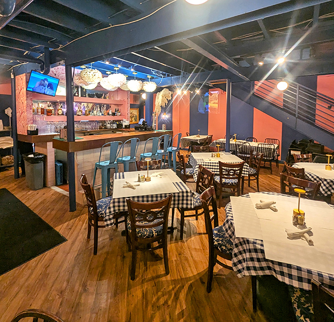Inside, coral and navy walls create a vibrant backdrop for morning feasts, while checkered tablecloths promise comfort food with a dash of sophistication.
