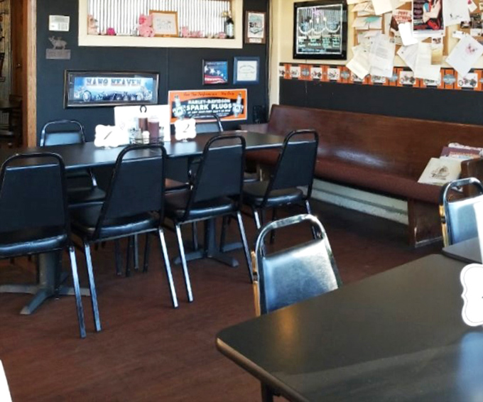 Simple seating, wood paneling, and walls plastered with memories—this is where BBQ pilgrims come to worship at the altar of slow-cooked perfection.