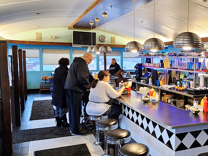 Counter culture at its finest—where regulars perch on chrome stools and conversations flow as freely as the coffee refills.