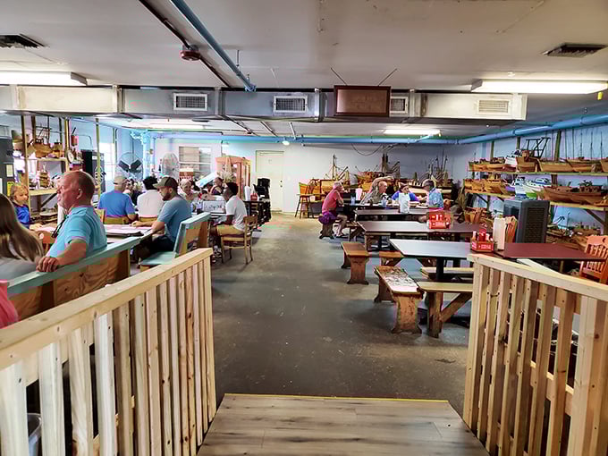 Where nautical charm meets seafood satisfaction. The blue walls and wooden benches create the perfect backdrop for the feast that awaits.