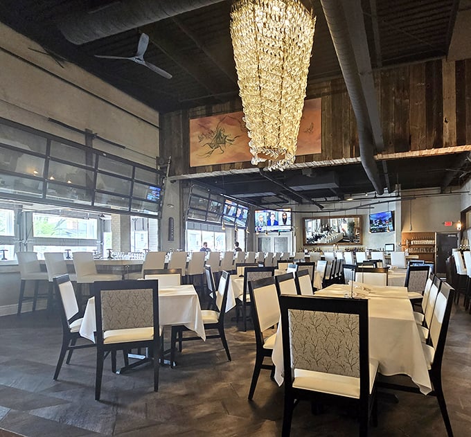 Crystal chandeliers meet rustic wood elements in M Italian's dining room, creating that perfect "fancy but not fussy" atmosphere we all crave.