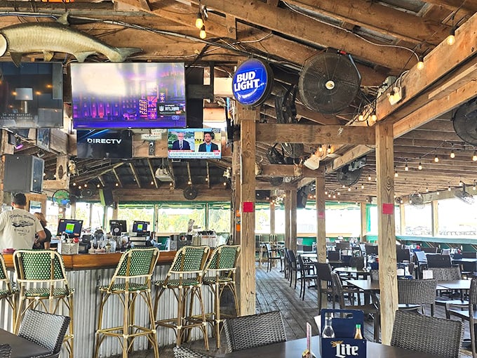 Rustic wooden beams, casual seating, and cold beer on tap – this isn't just a bar, it's Florida's living room by the water.