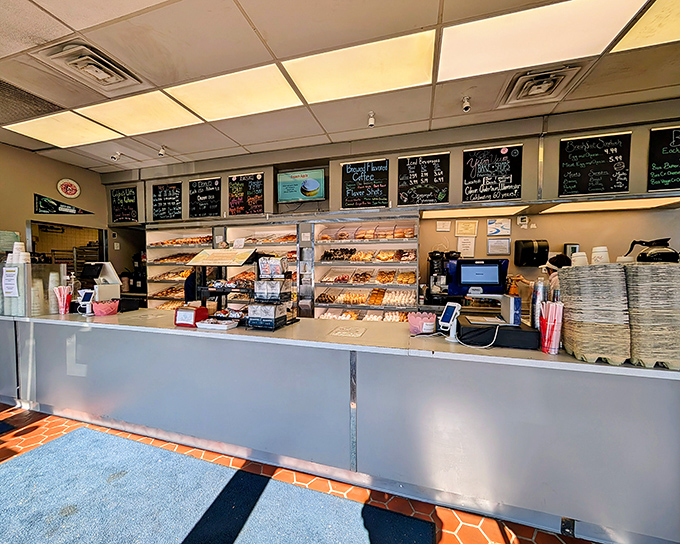 Step inside and behold the promised land – where fluorescent lights illuminate trays of handcrafted donuts that make chain bakeries look like sad imposters.