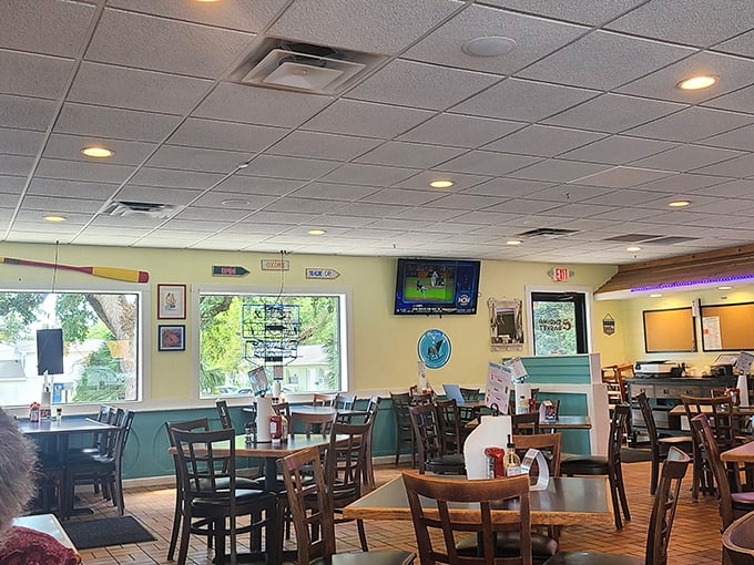 No white tablecloths here—just aqua wainscoting, wooden tables, and the promise of honest-to-goodness Gulf seafood in a setting that feels like home.