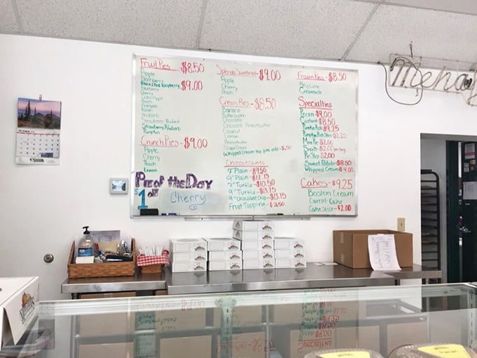 The handwritten menu board tells you everything you need to know—this place prioritizes pies over pretension.
