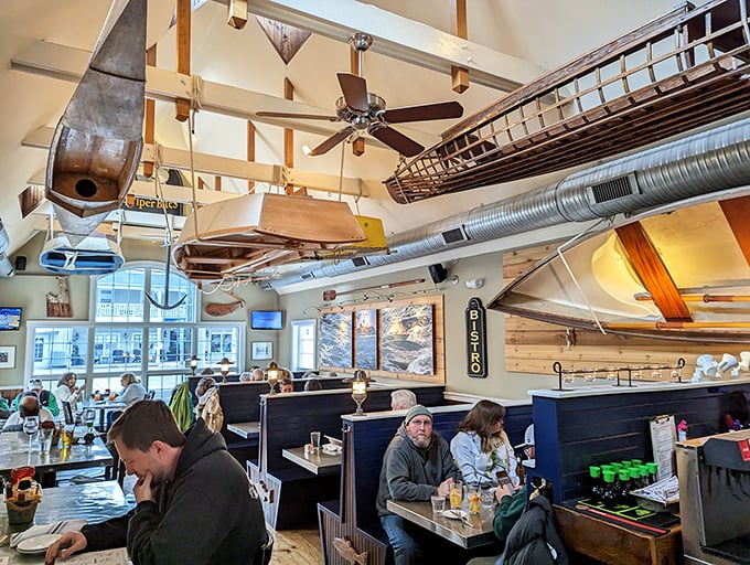 Boats suspended from the ceiling aren't just decoration—they're conversation pieces that float above diners while setting the perfect maritime mood for seafood feasting.