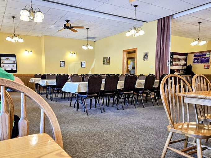 Yellow walls and wooden chairs create the kind of warmth your grandmother's dining room had, minus the plastic-covered sofa.