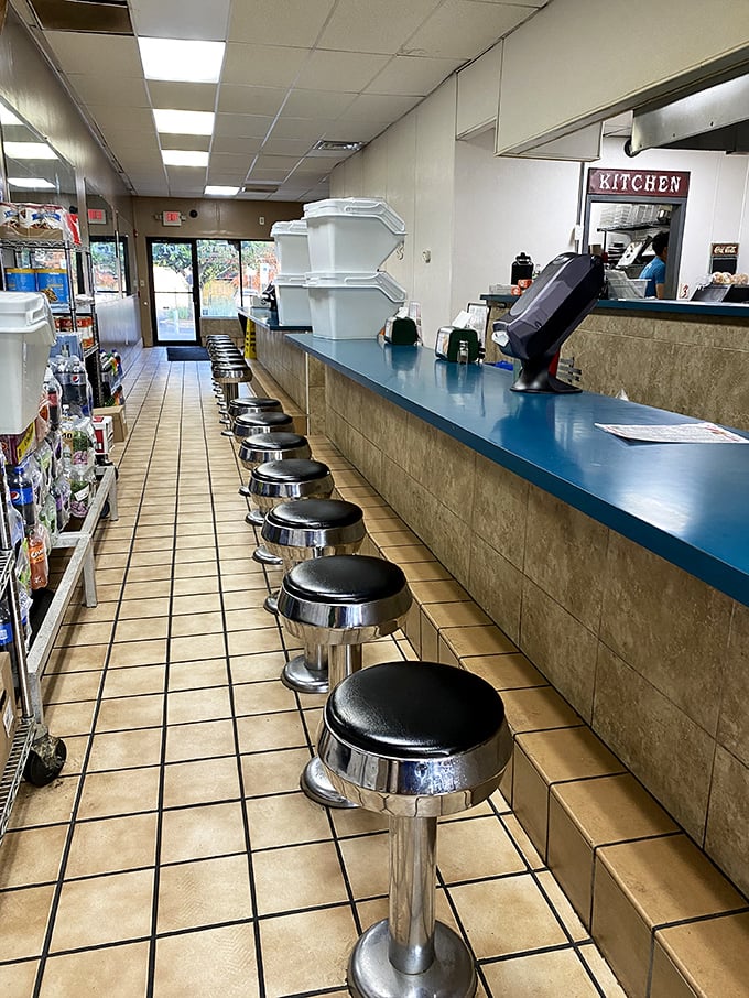 Classic diner-style counter seating where culinary magic happens. This isn't fine dining—it's something better: authentic Philadelphia soul food.