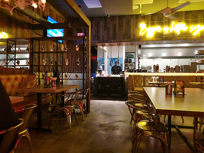 Industrial-chic meets cozy comfort inside Burgermeister, where reclaimed wood walls and that "Burger is love you" neon sign remind you why you came in the first place.