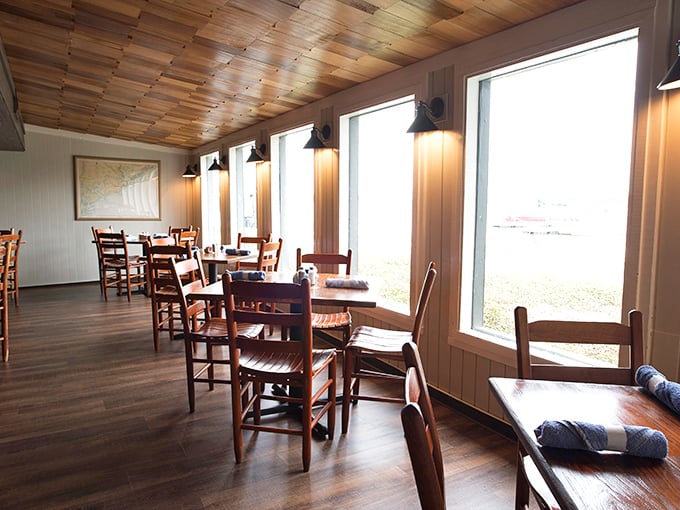 Floor-to-ceiling windows frame nature's daily masterpiece while wooden charm whispers, "Relax, you're home now."