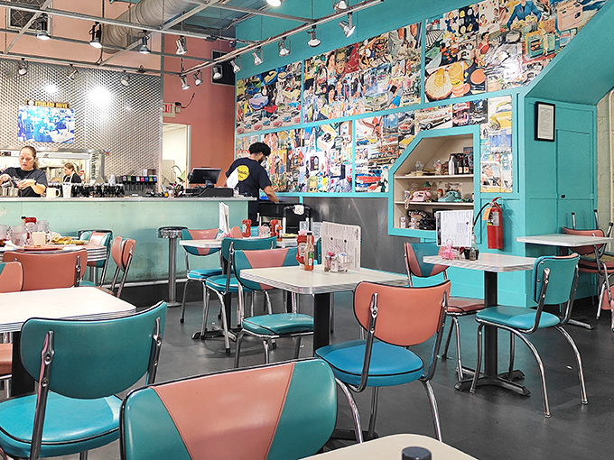 Retro meets modern in this cheerful space where turquoise chairs and coral accents create breakfast bliss.