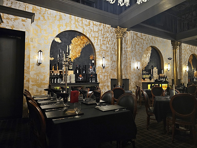 Gold-leafed walls and elegant arches create a dining room that whispers "special occasion" while the chairs practically beg you to linger over dessert.
